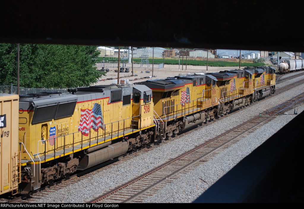UP 5081 clears overpass as UP freight heads westbound
